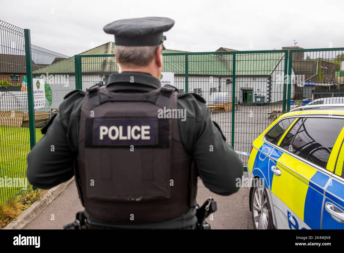 An officer from the PSNI at the scene following a shooting on Sunday of ...