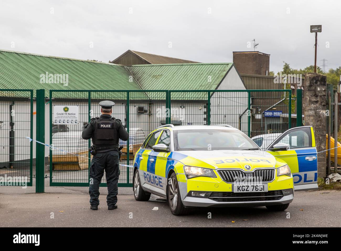 An officer from the PSNI at the scene following a shooting on Sunday of ...