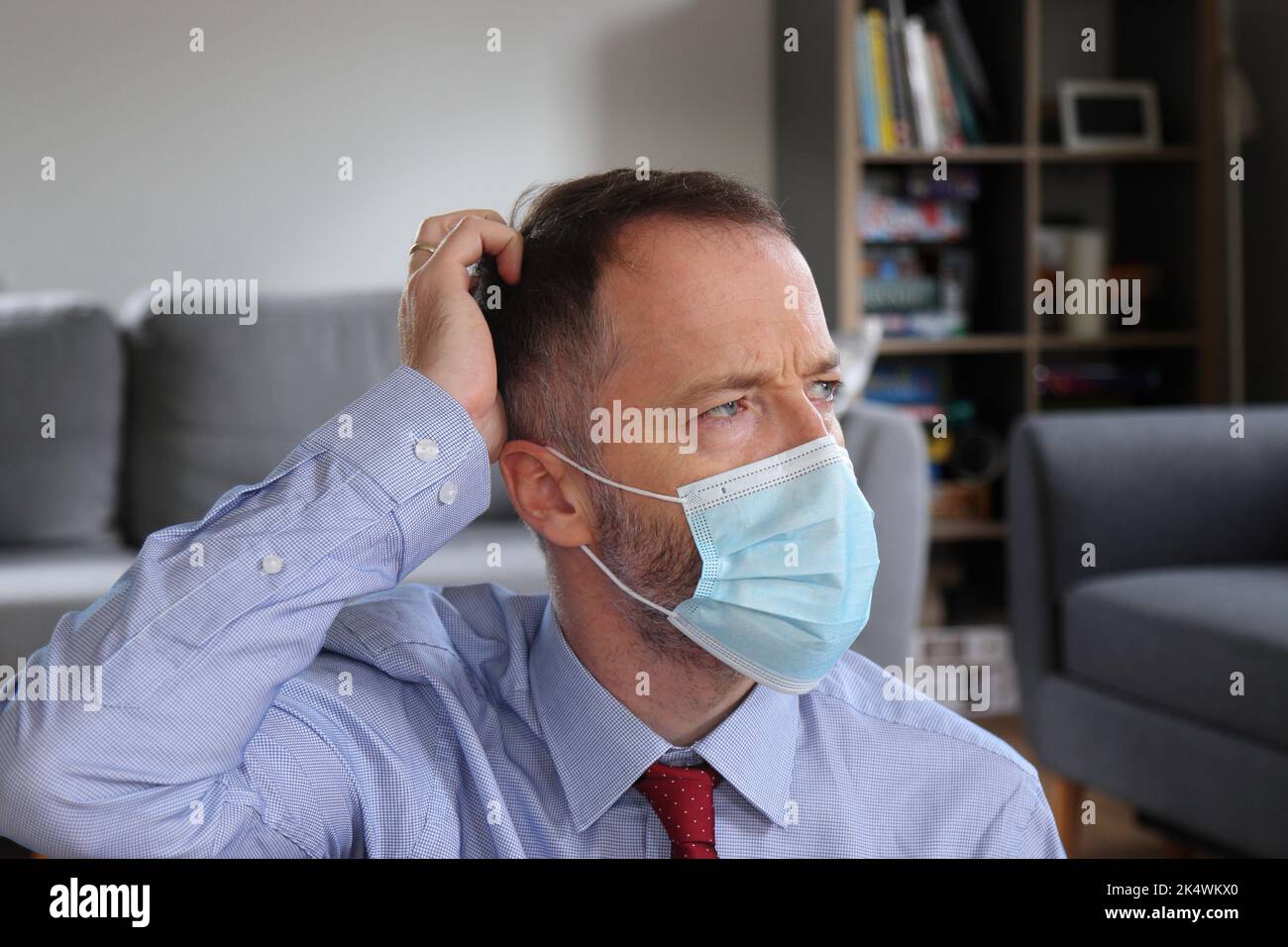 Man scratching beard mask hi-res stock photography and images - Alamy
