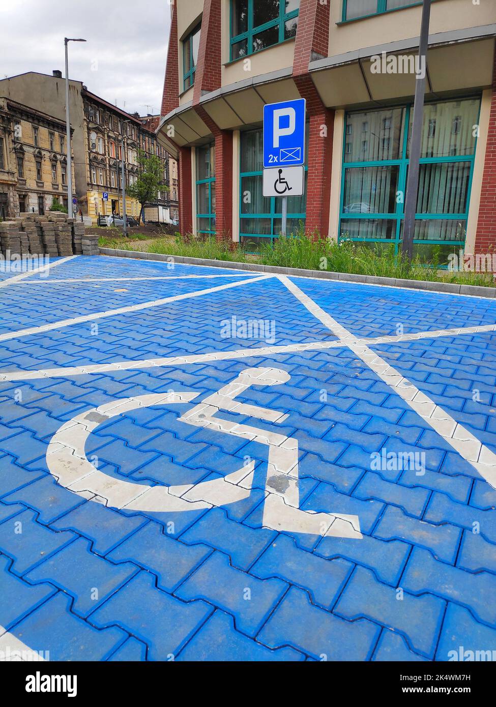 Accessible parking space. Disabled street parking spot in front of ... Accessible parking space. Disabled street parking spot in front of ...