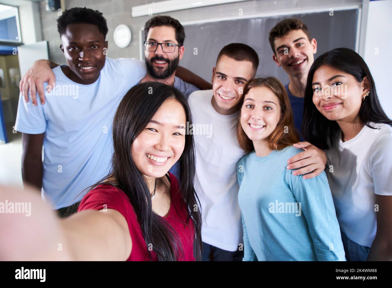 Portrait of a cheerful multiracial group of friends taking a selfie ...