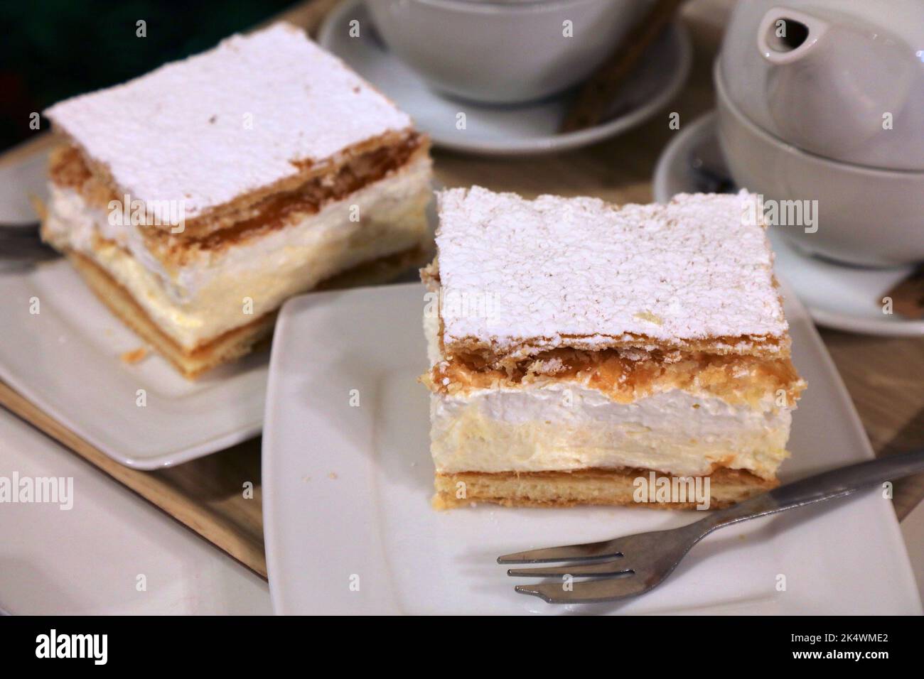 Kremowka cake in Poland. Traditional Polish sweet cuisine: cream cake ...