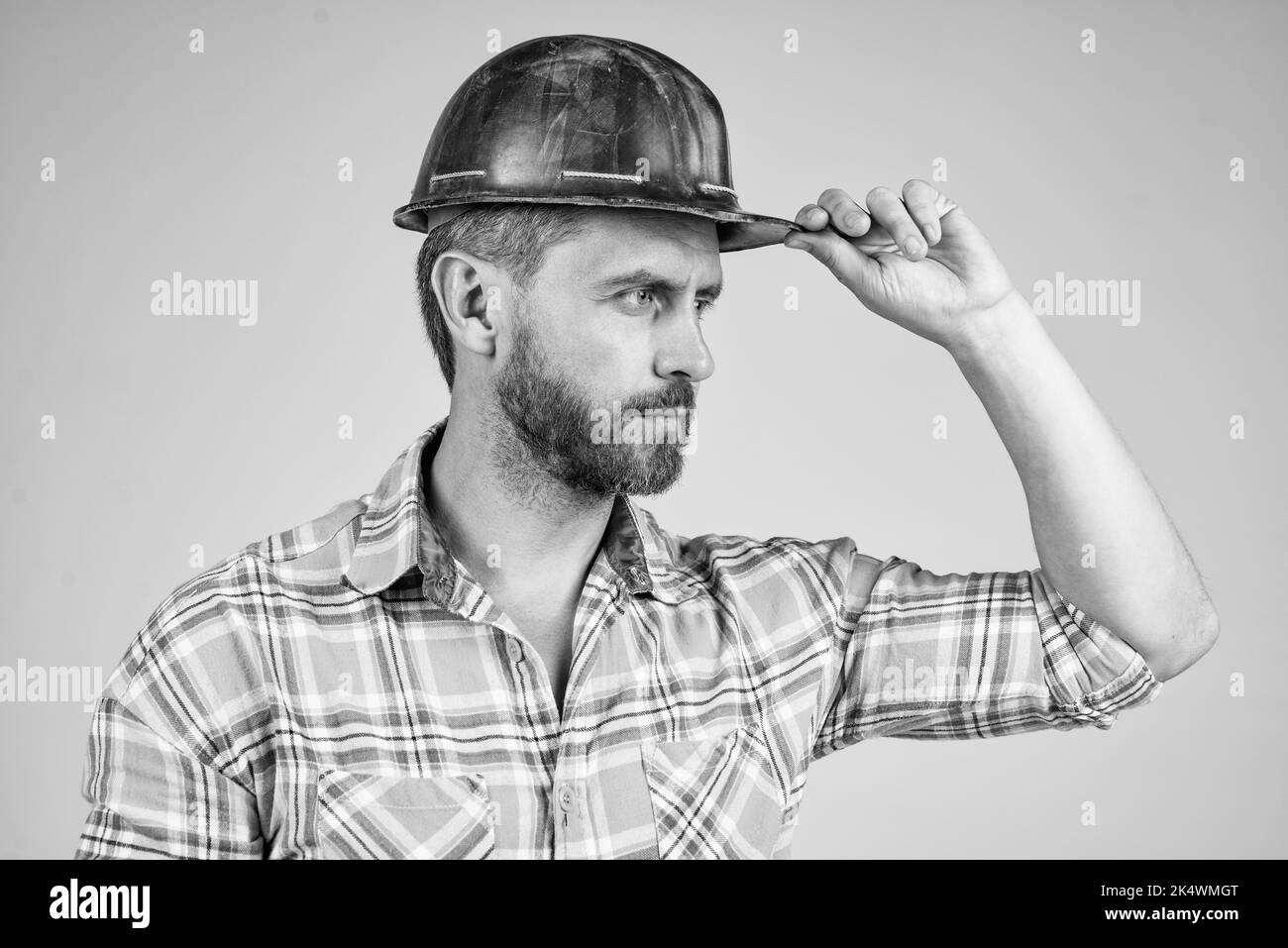 man architect with serious look. guy wear worker uniform. handsome ...