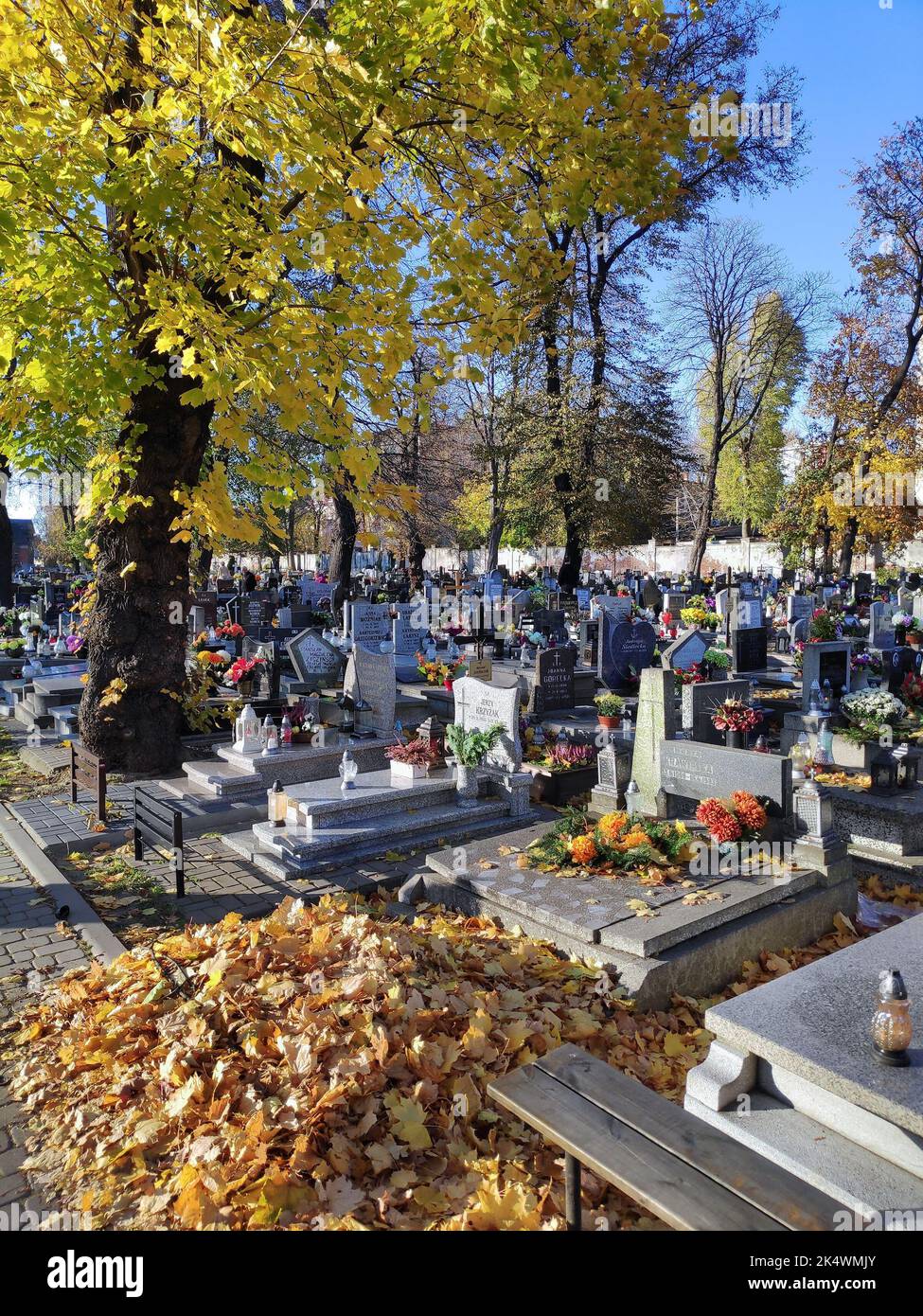 BYTOM, POLAND - OCTOBER 30, 2021: Autumn view of graves and candles at ...