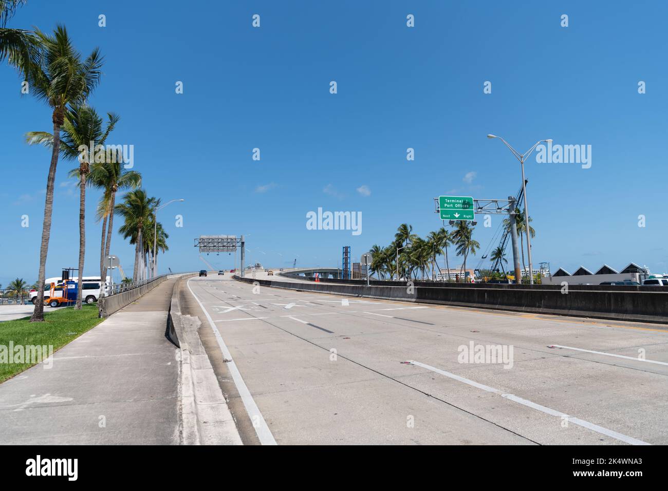 summer empty bridge road with palms and blue sky Stock Photo - Alamy