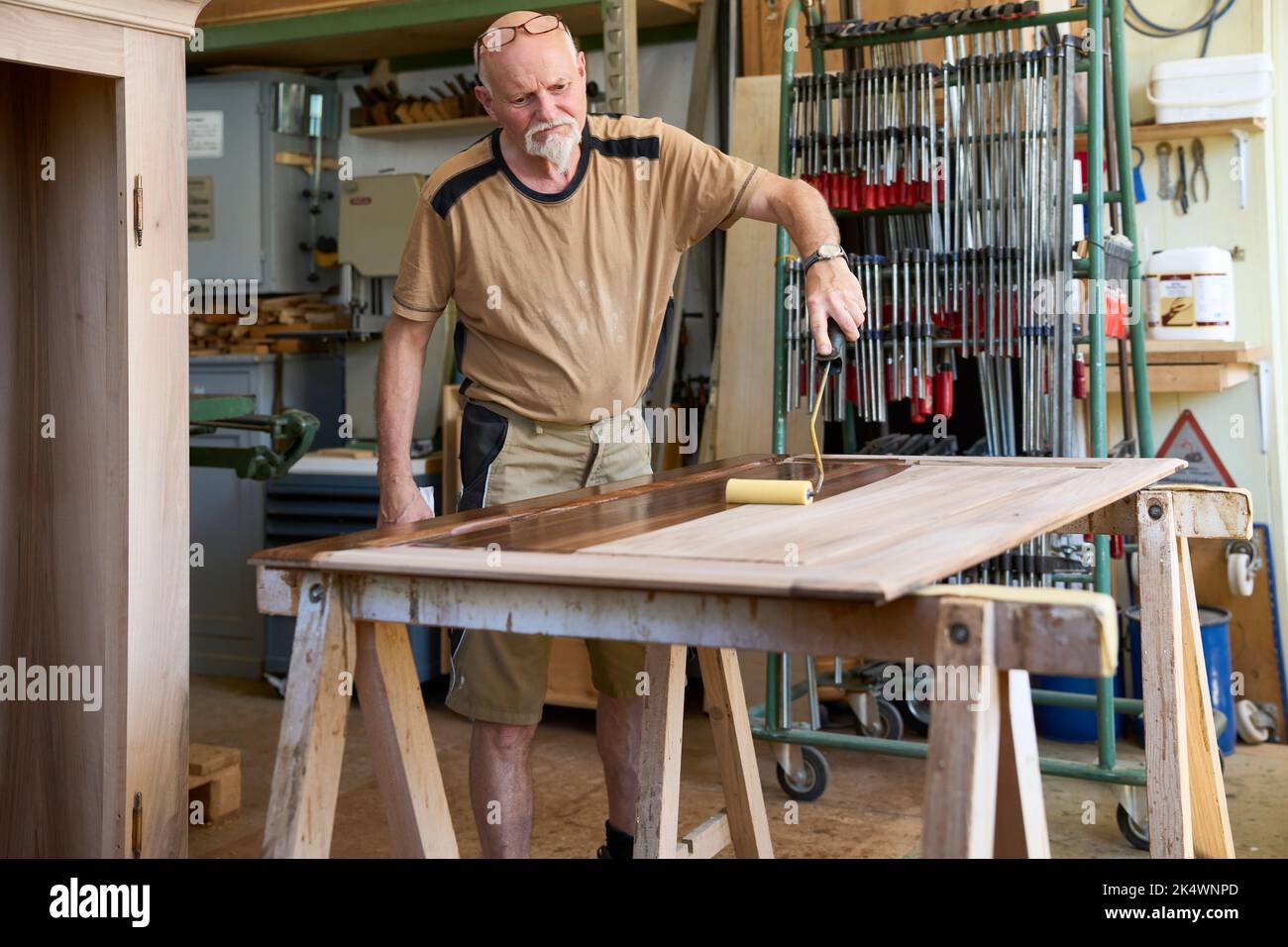 Antique Carpenter In His Workshop Oiling A Walnut Baroque Cabinet Door ...