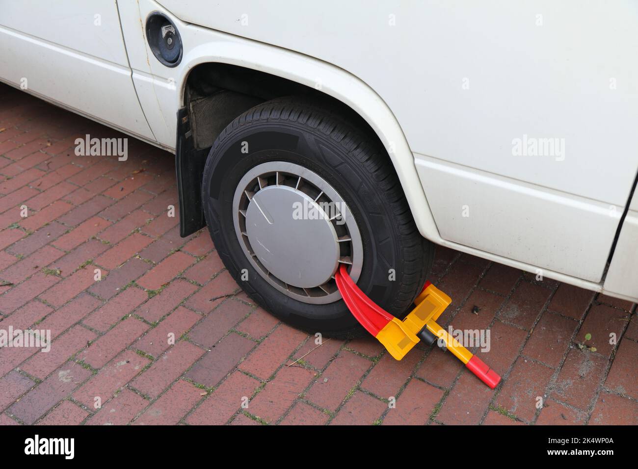 Wheel clamp on a van in Cologne, Germany. Improper parking car wheel ...