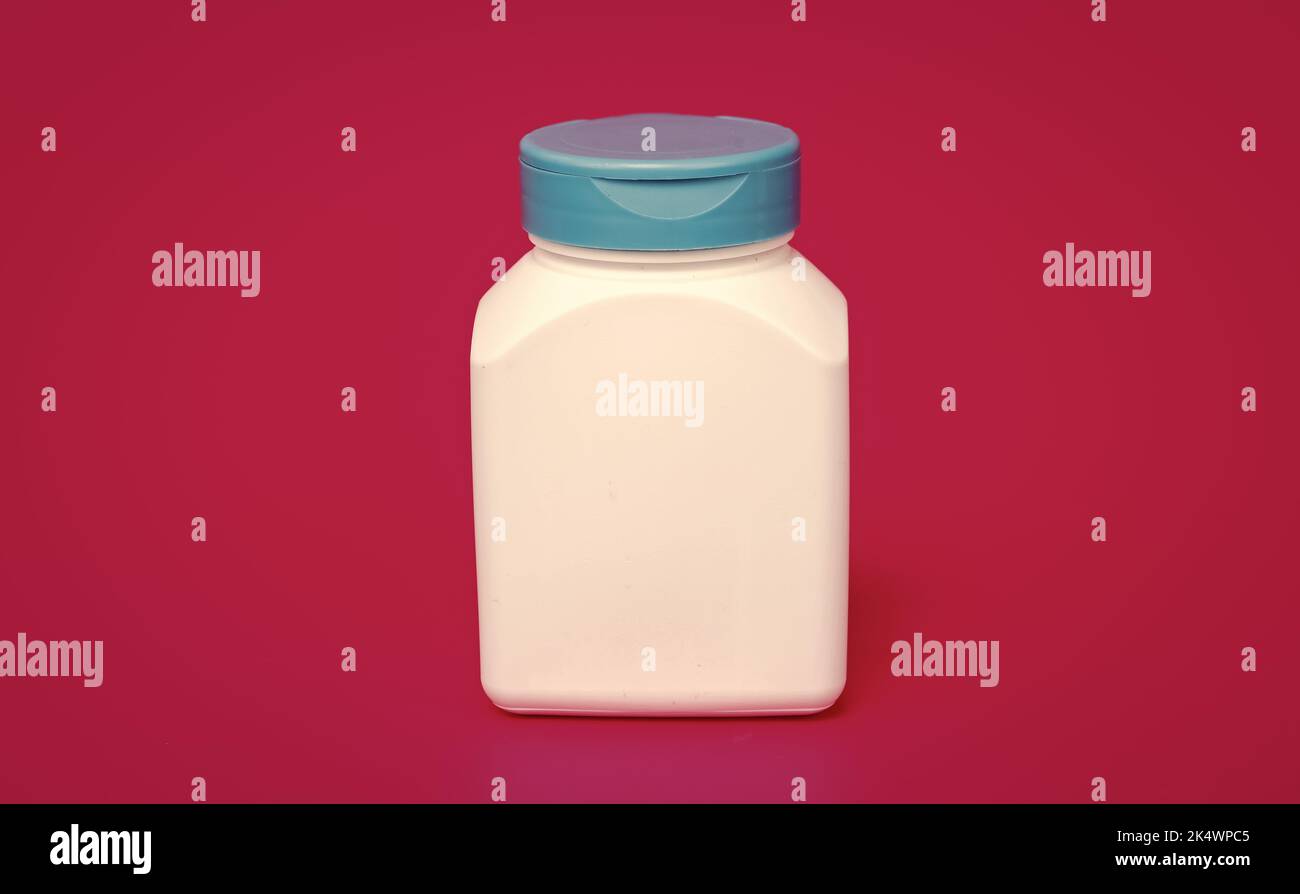 food supplement. presenting vitamin product. white unbranded pill jar ...