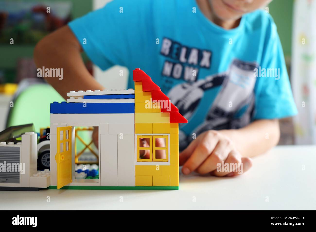 Boy builds a house with building blocks (Model released Stock Photo - Alamy