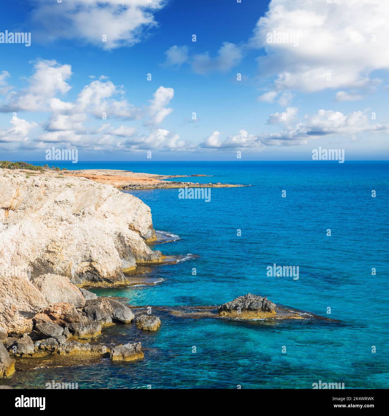 Seaside view with rocks and sea water under cloudy sky. Ayia Napa ...