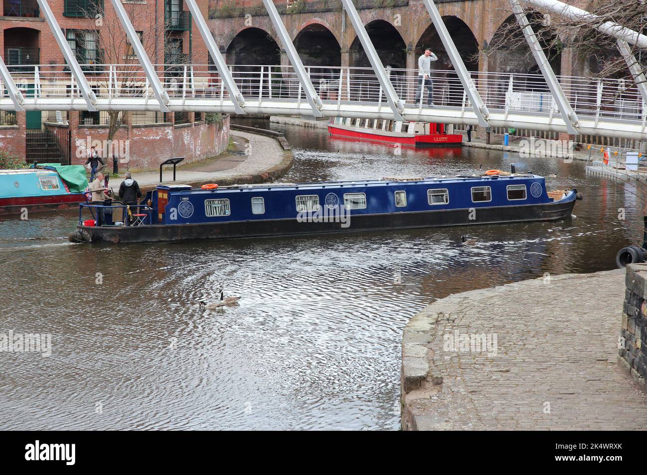 MANCHESTER, UK - APRIL 21, 2013: People visit Castlefield canals area ...