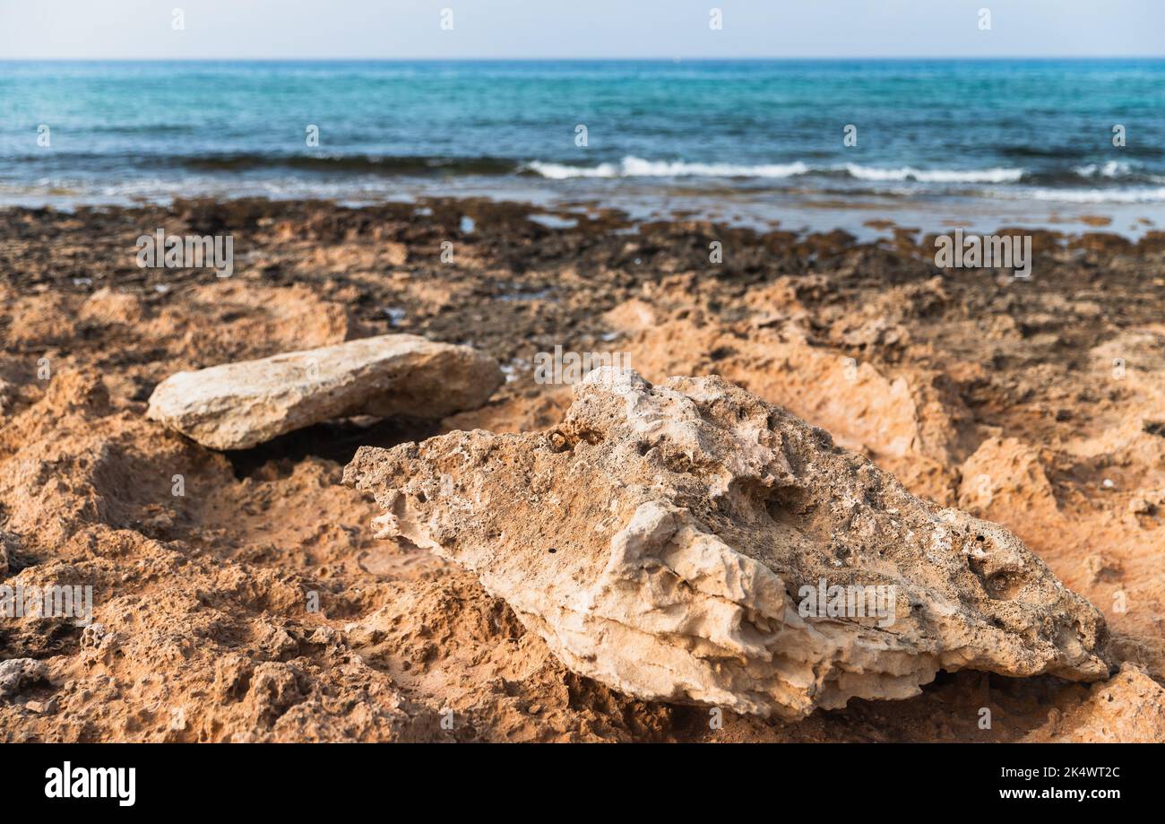 Sharp rocks are at Mediterranean Sea coast. Summer landscape of Ayia ...