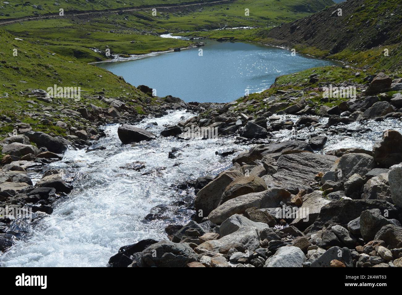 Water going down from top to lake Stock Photo - Alamy