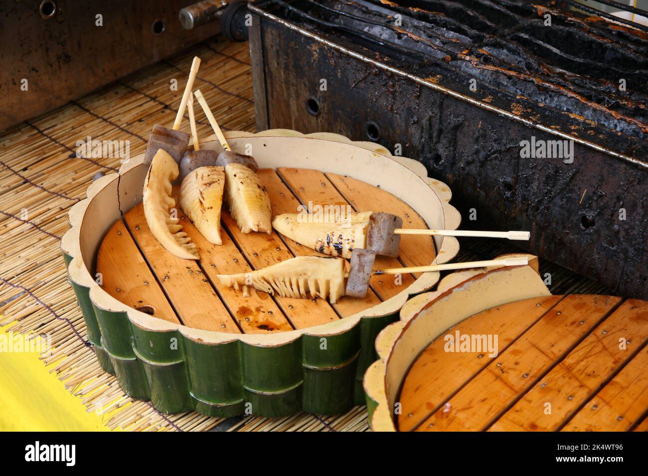 Japanese cuisine. Street food in Kyoto, Japan. Barbecued bamboo shoots ...