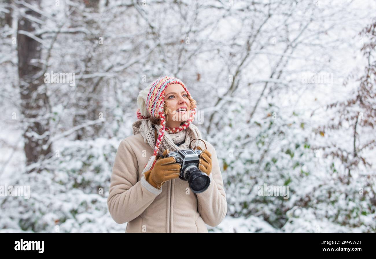 Enjoy beauty of snow scenery through photos. Woman photographer with ...