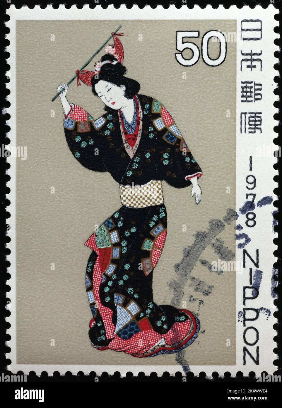 Japanese woman wearing a colorful kimono on postage stamp Stock Photo ...