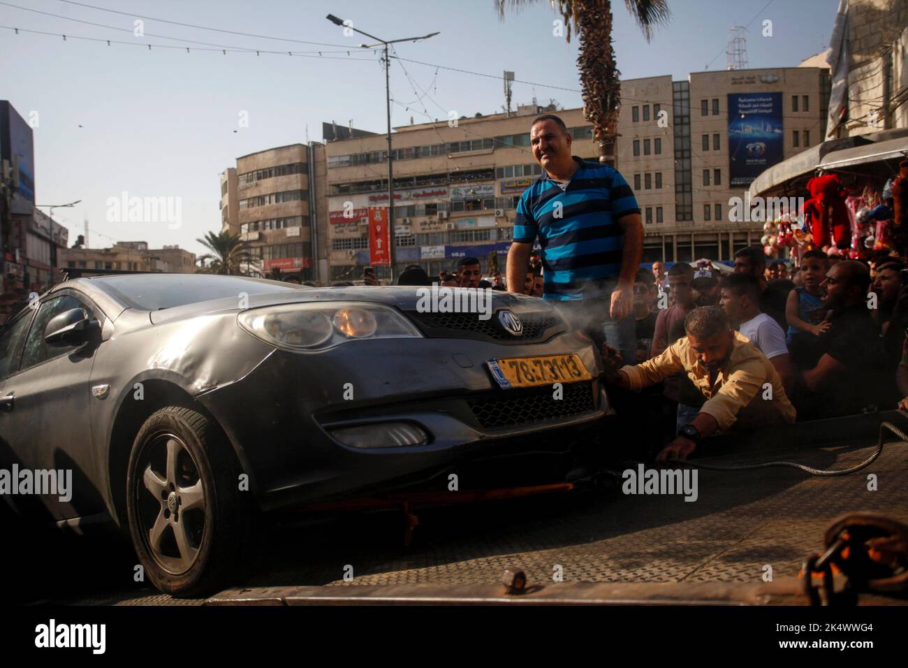 Nablus, Palestine. 4th Oct, 2022. Palestinian security forces transfers a car belonging to ...