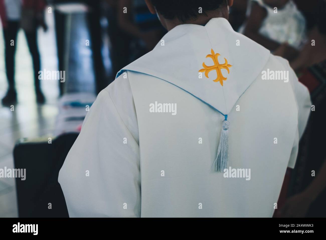 Giant gold cross set embroidery at the back of the stole worn by ...