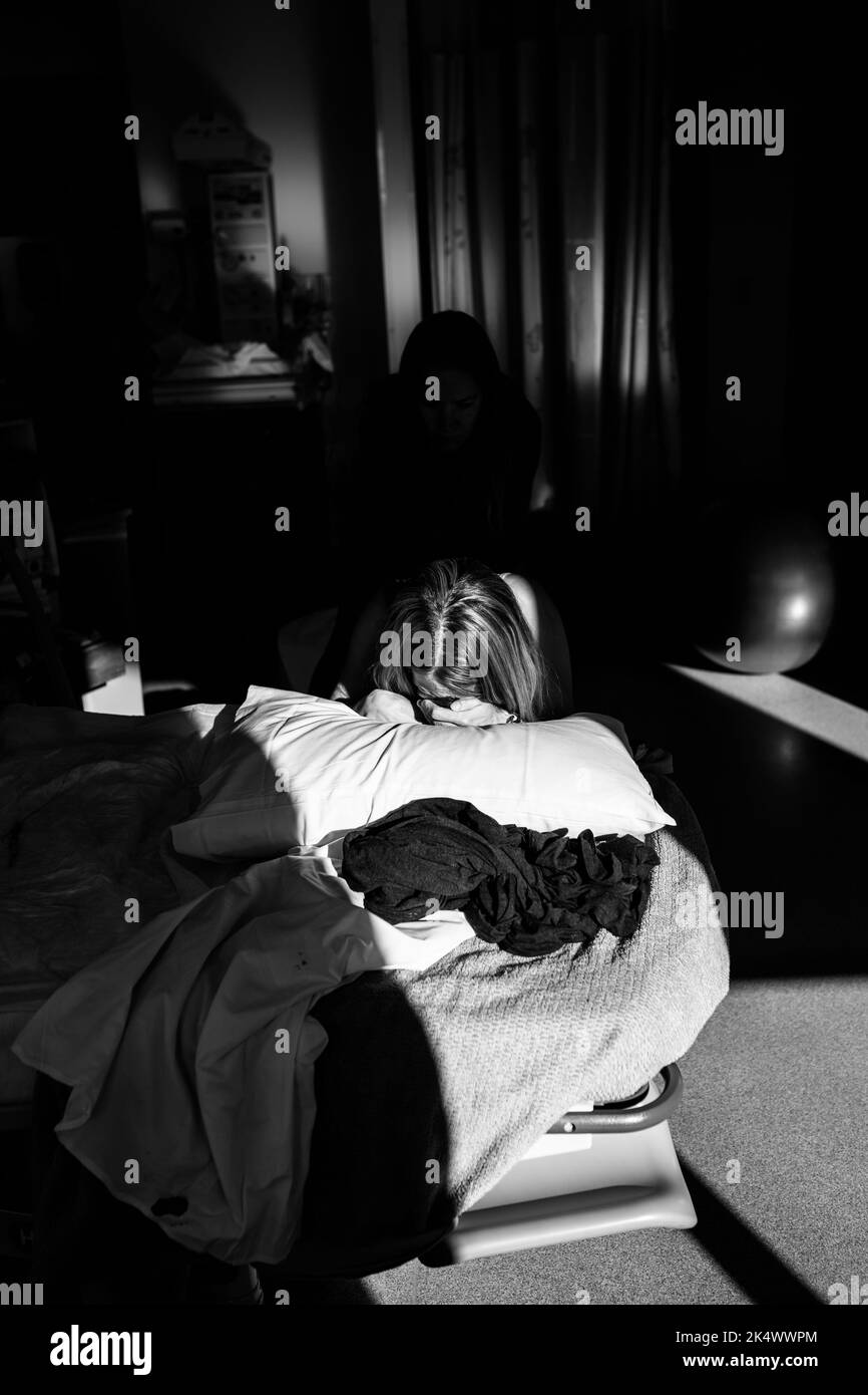 Woman laboring on her knees in hospital overhead shot Stock Photo - Alamy