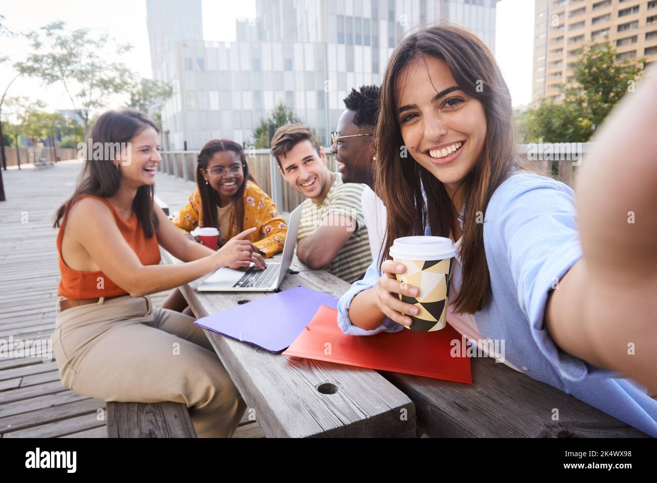 Happy selfie of a beautiful white lady at university campus gathering ...