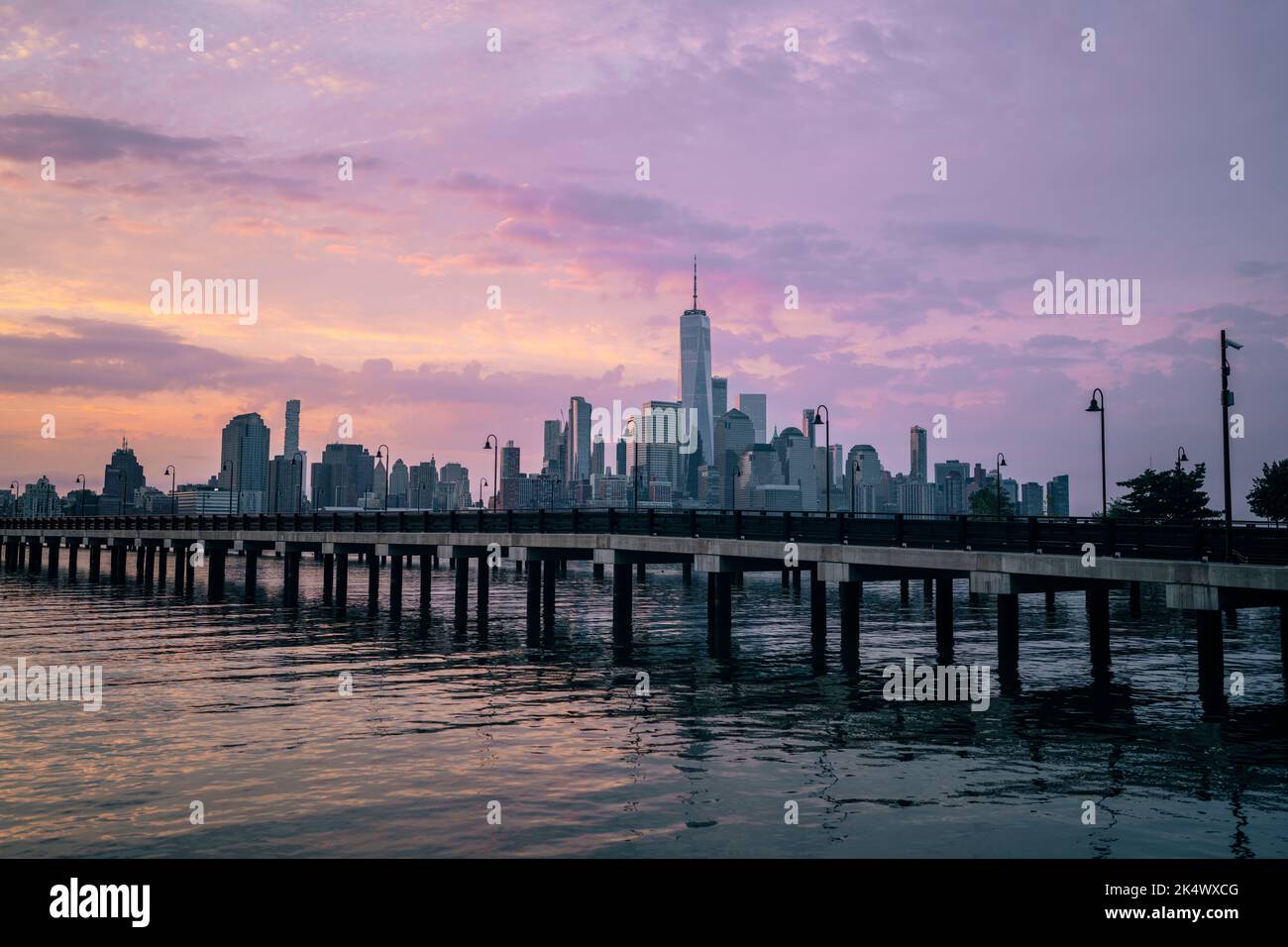 city skyline at sunset colors beautiful sky violet Stock Photo - Alamy