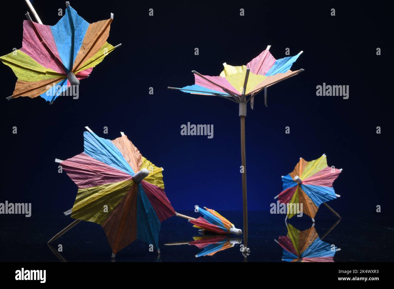 Different miniature paper cocktail umbrellas Stock Photo - Alamy
