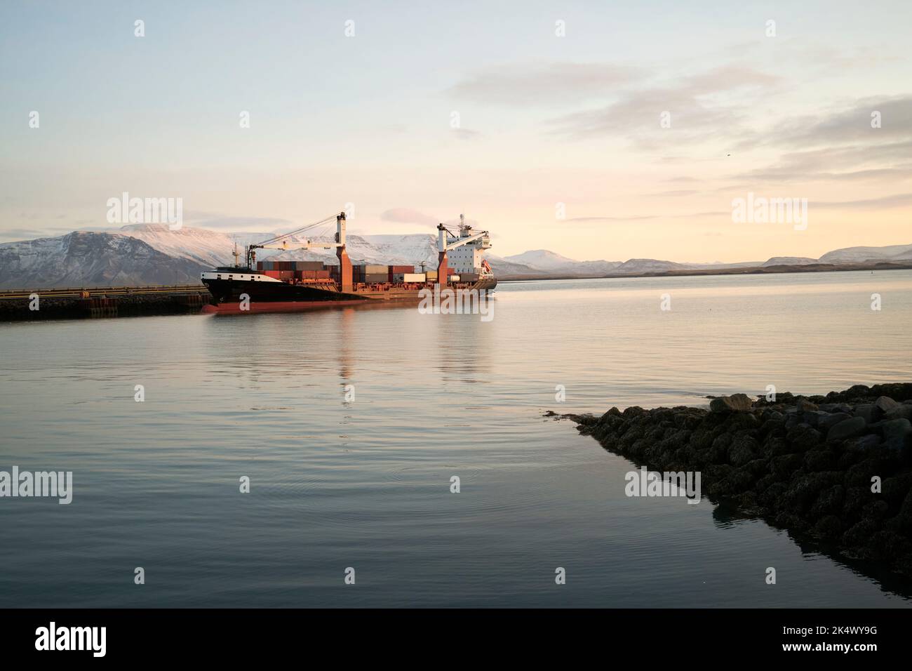 Cargo ship in calm sea Stock Photo - Alamy
