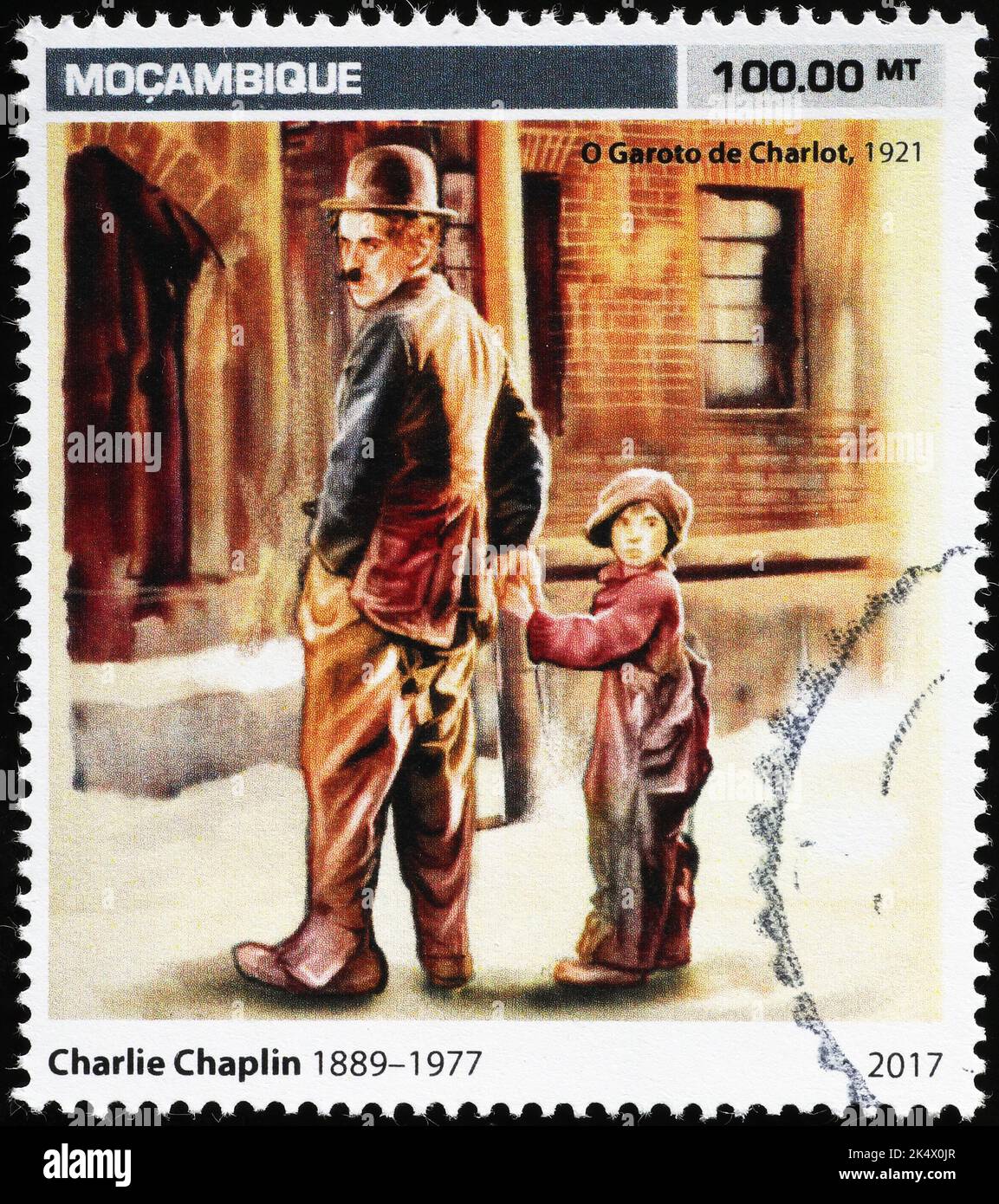 Scene from The Kid by Charlie Chaplin on postage stamp Stock Photo - Alamy