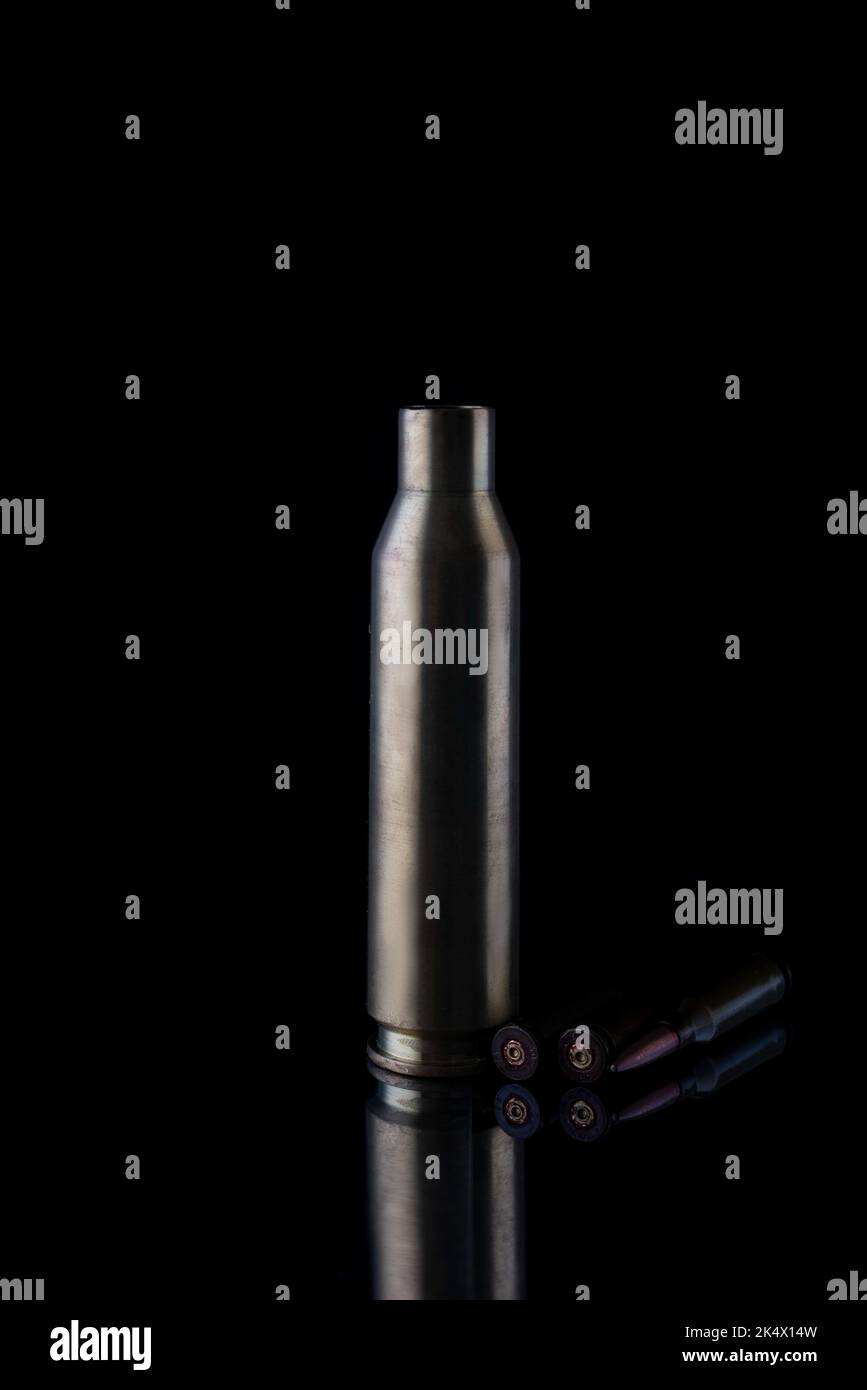 high caliber cartridge case on black background Stock Photo - Alamy