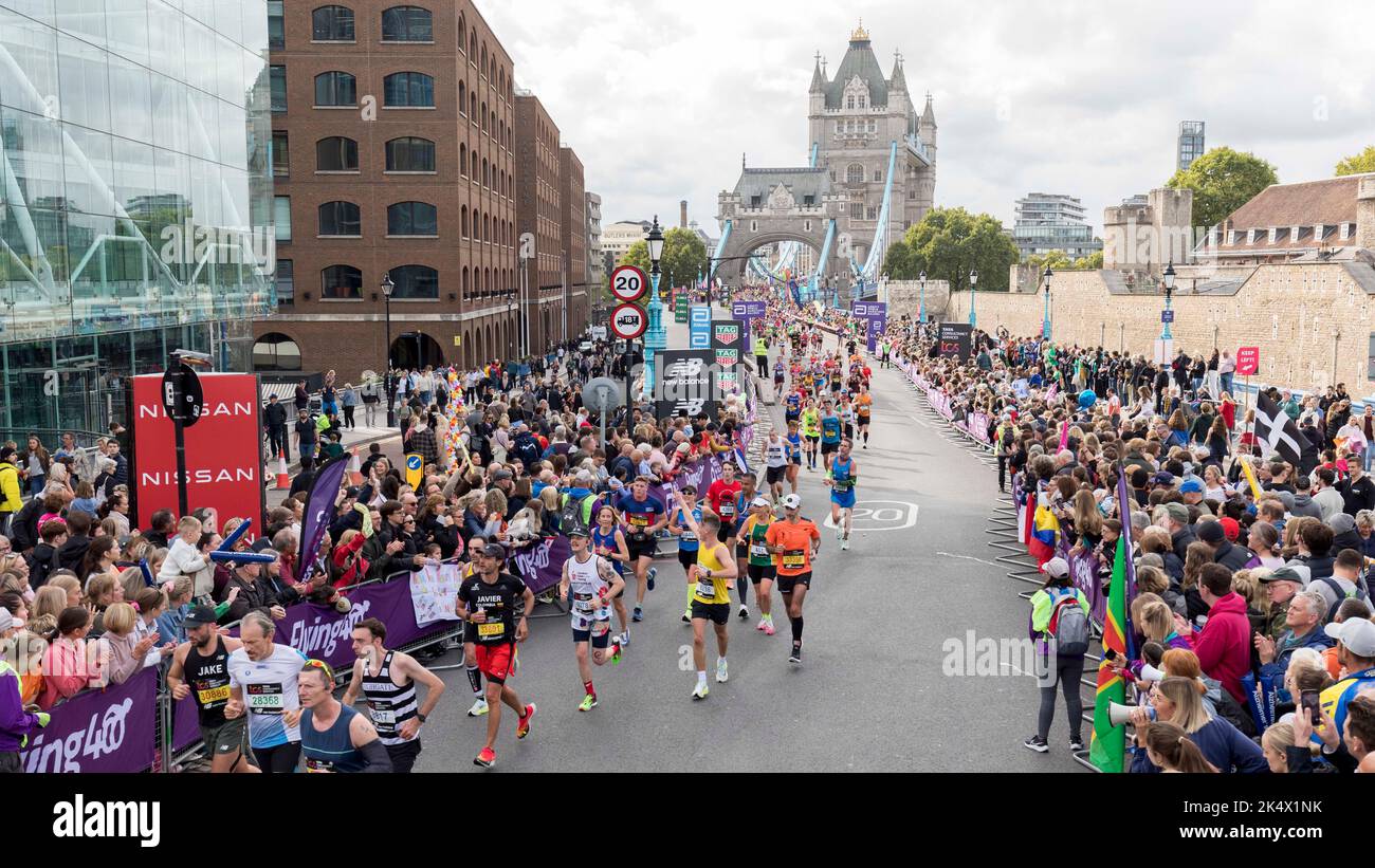 TCS London Marathon 2022 takes place today. Runners run past Tower ...