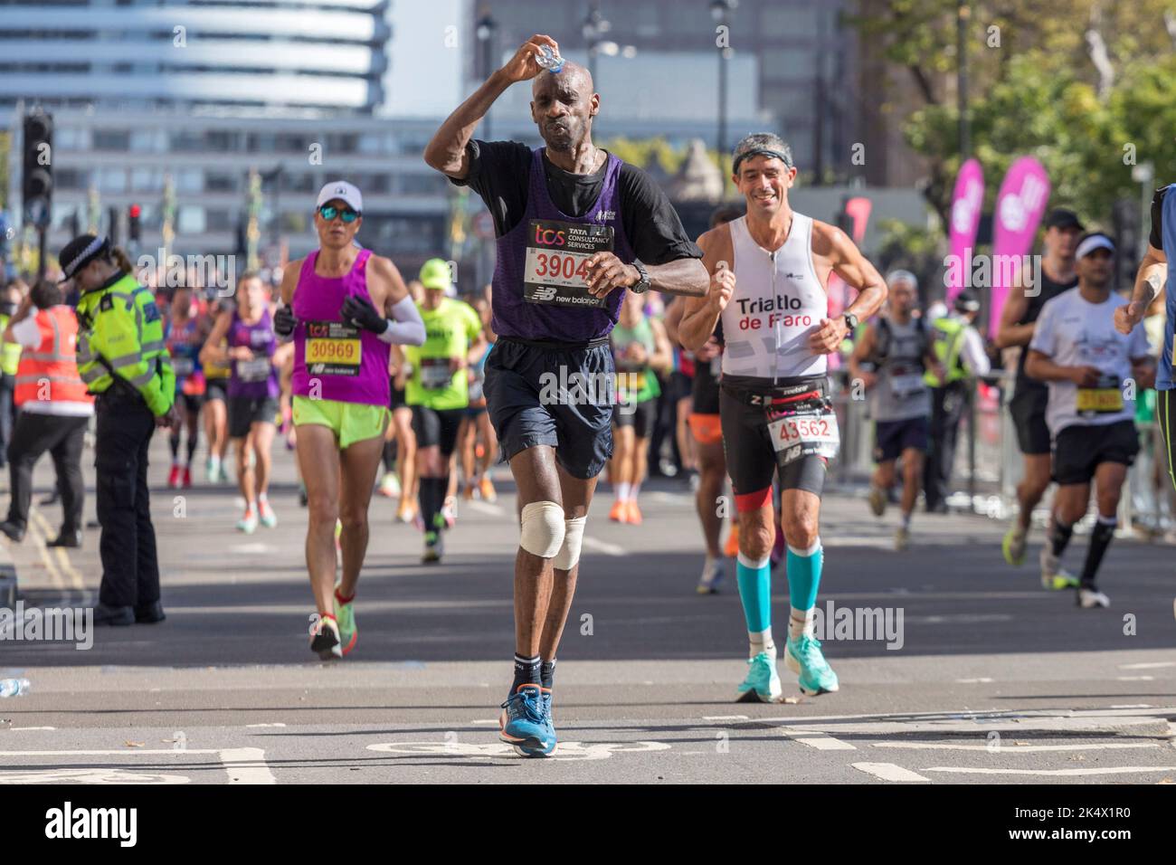 TCS London Marathon 2022 takes place today. Runners run past Houses of ...