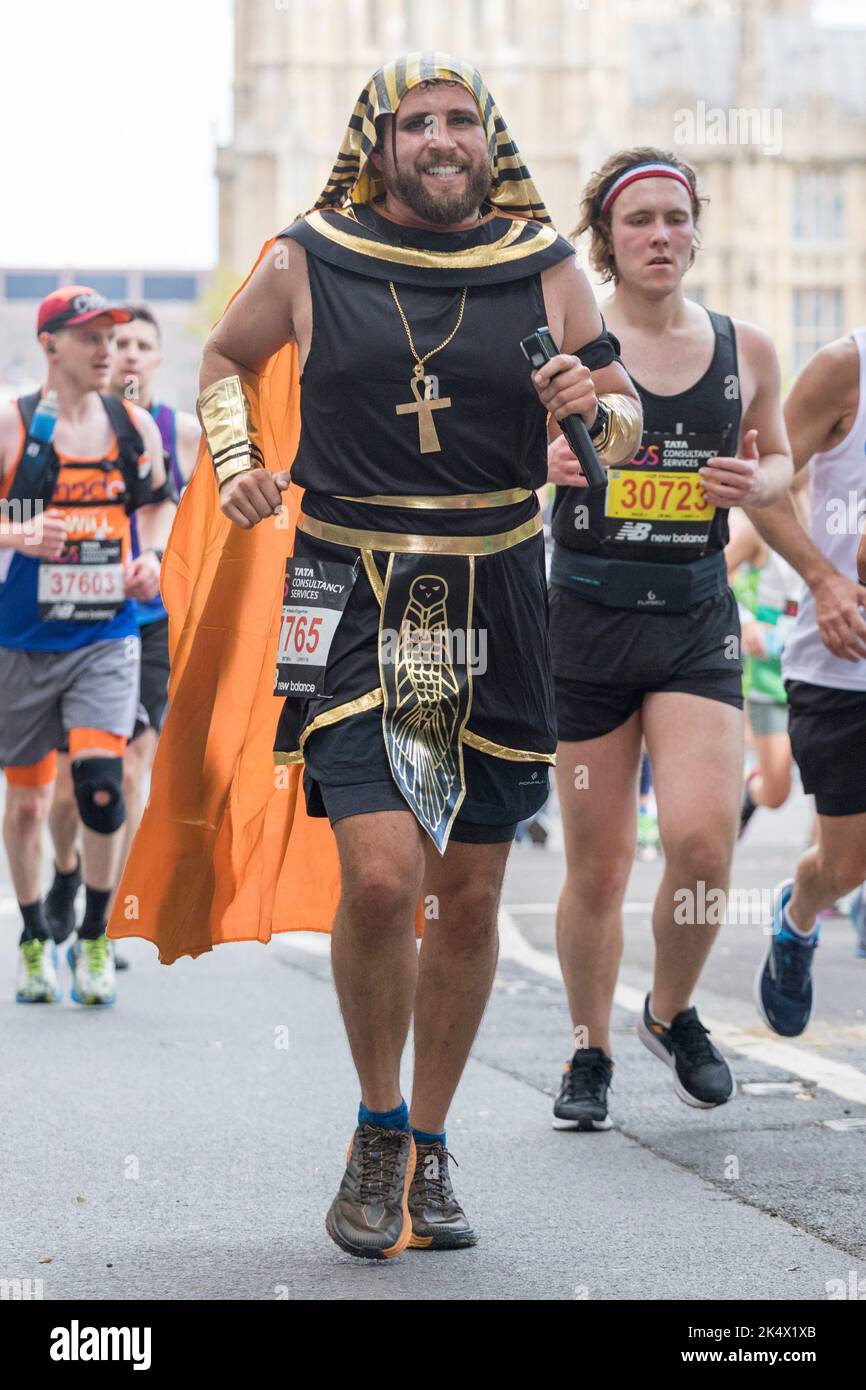 TCS London Marathon 2022 takes place today. Runners run past Houses of ...