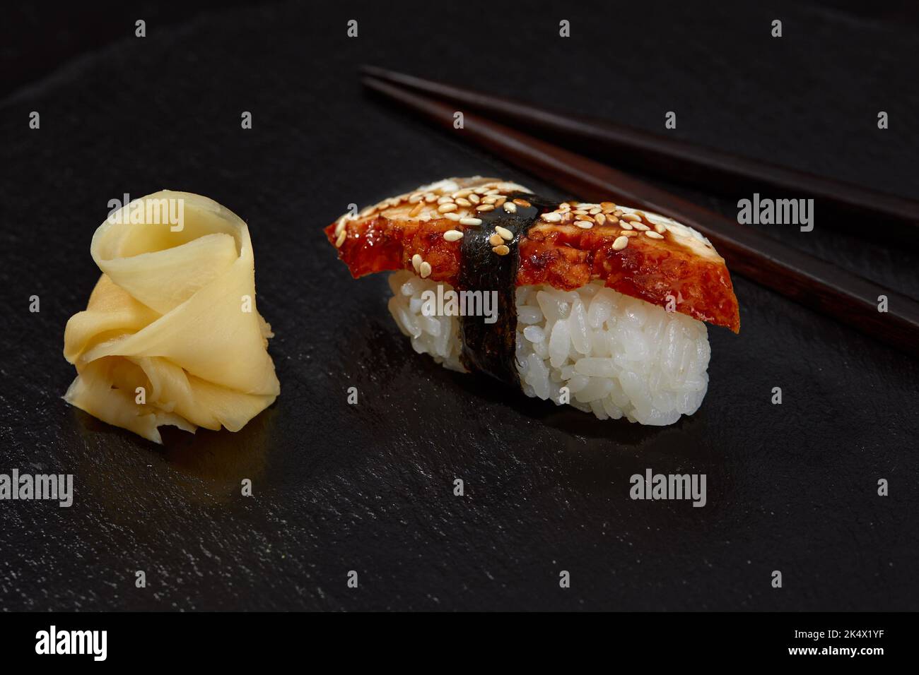 Delicious Unagi Eel Nigiri Sushi Eel Sushi on black background. Traditional Japanese cuisine ...