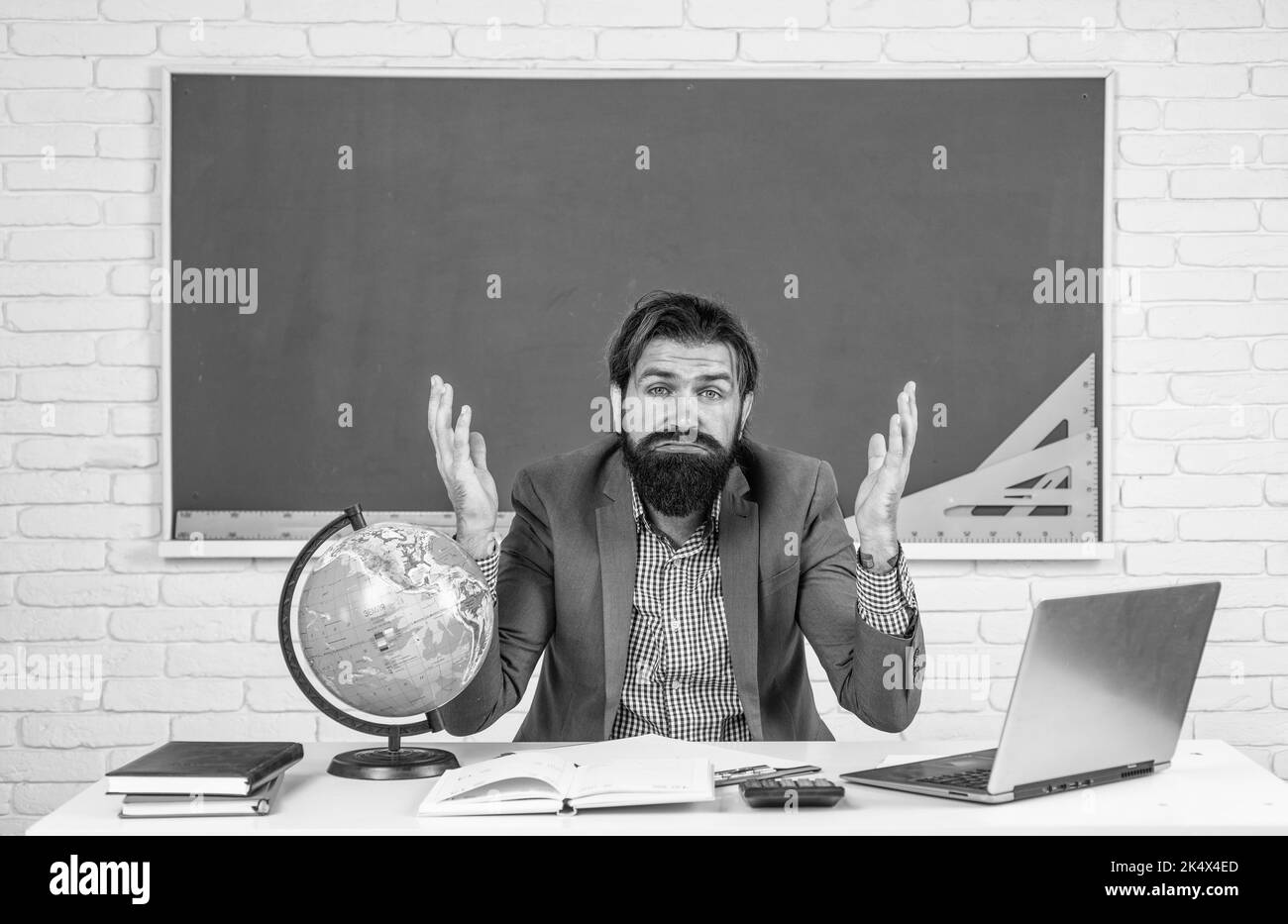 overworked man with beard having stress. troubles in studying. formal ...