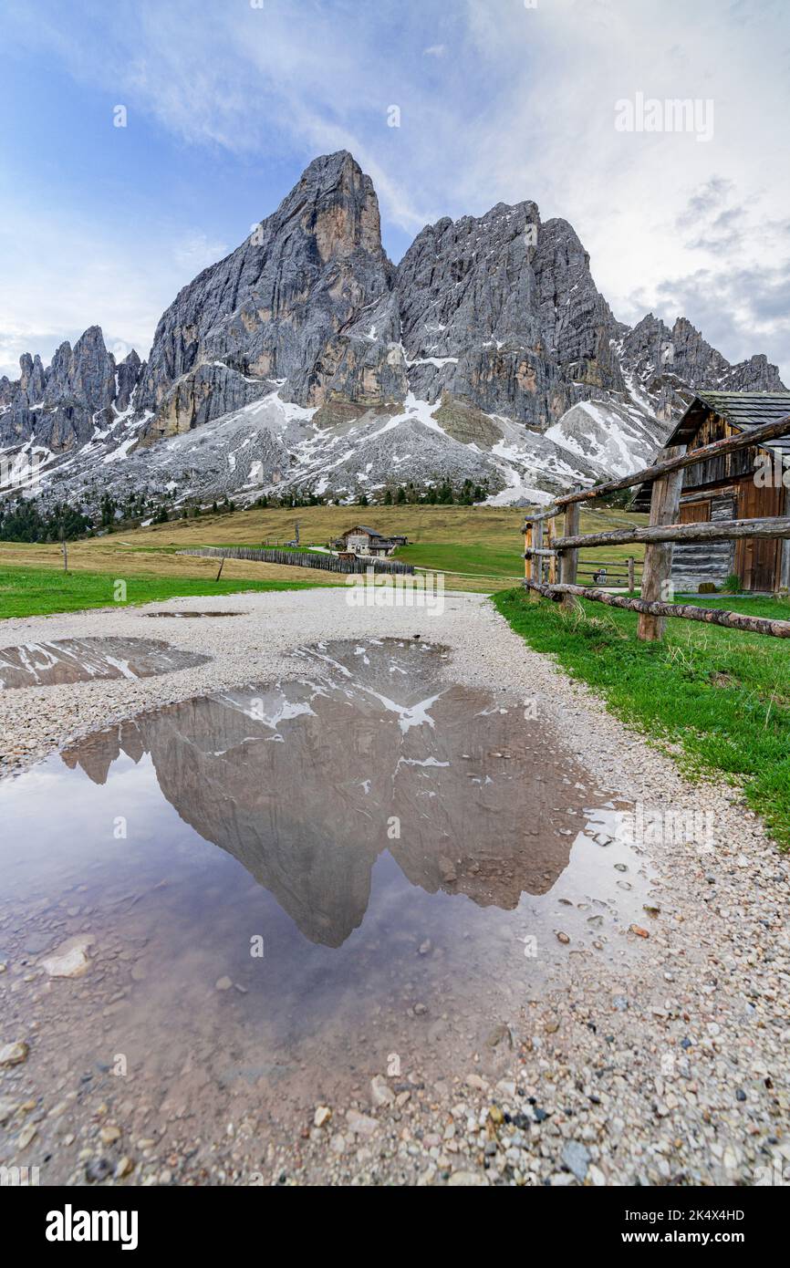 Sass De Putia mountain peak mirrored in a pond at Passo Delle Erbe ...