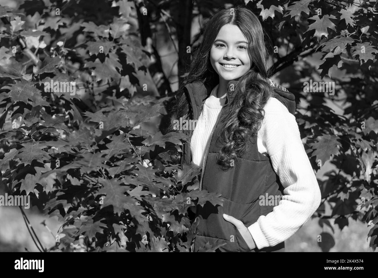 natural beauty. fall season fashion. teen girl with curly hair among ...