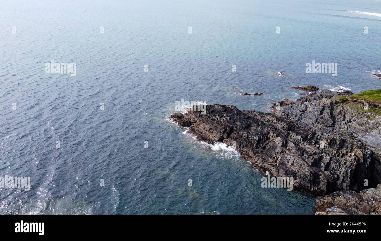 A large stone cape among the waters of the Atlantic Ocean, top view ...