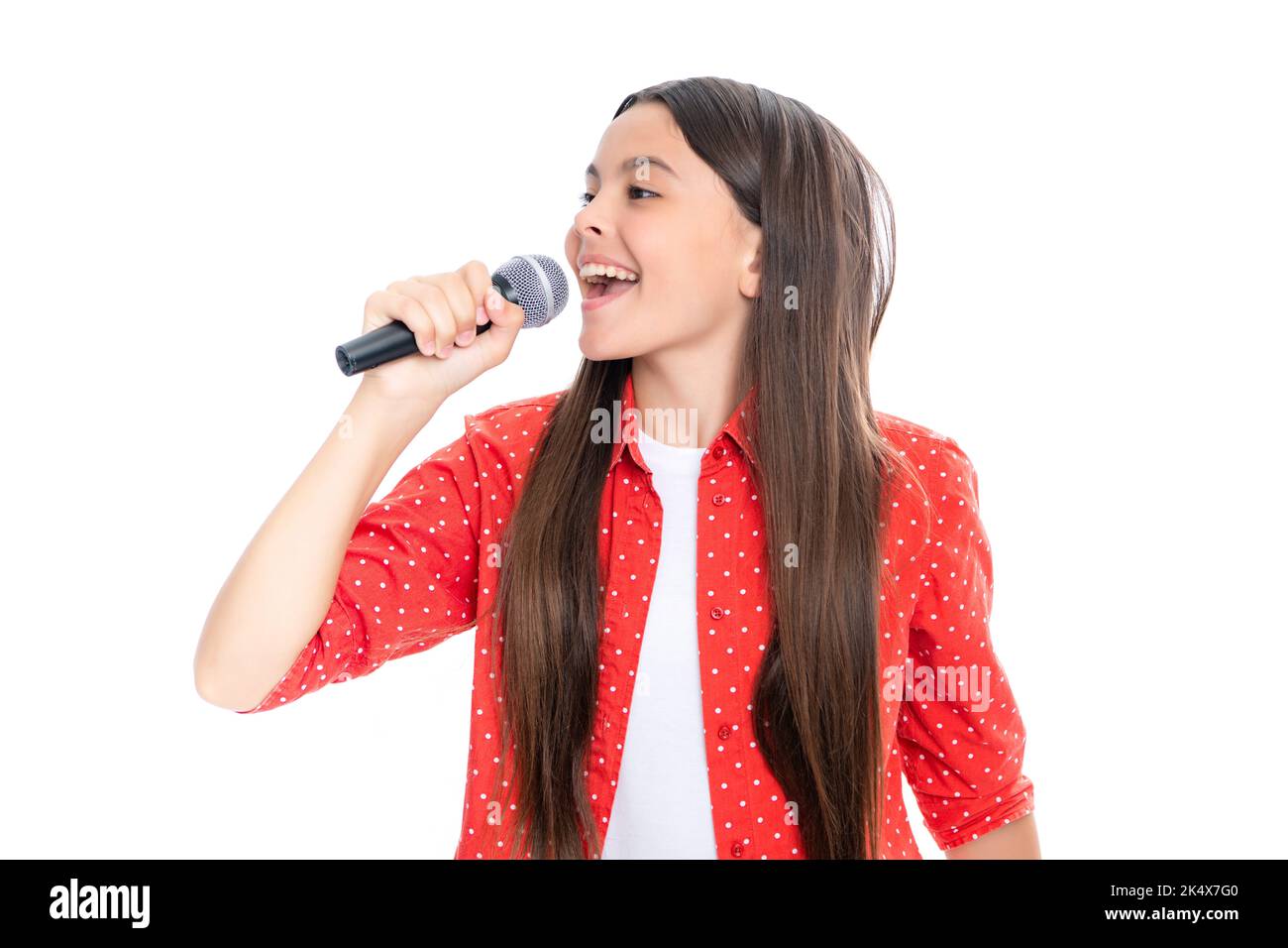 Teenager singing with a microphone. Karaoke singer. Teen girl sings ...