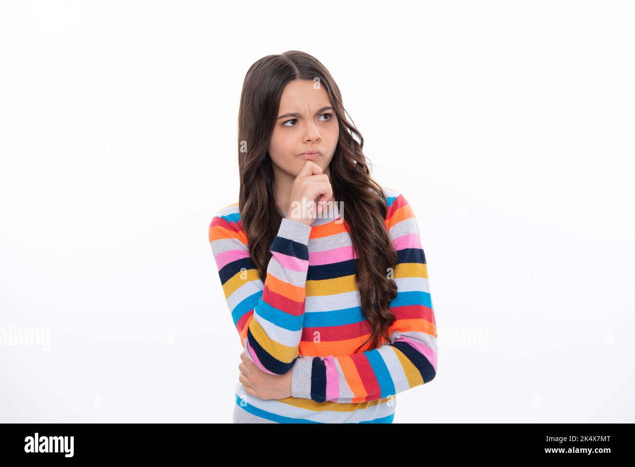 Thoughtful teenage child girl on white isolated background. Portrait of ...