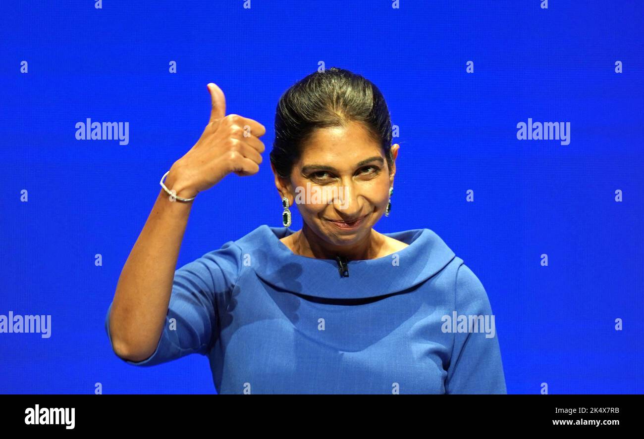 Home Secretary Suella Braverman gives a thumbs up after her speech at ...