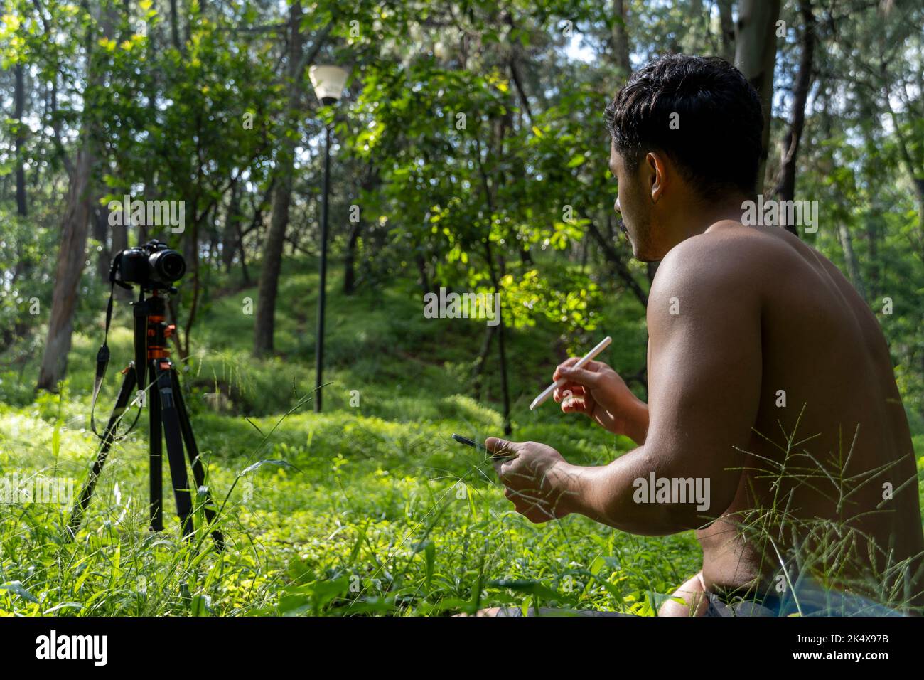 hispanic latino man giving class, while being recorded by a camera ...