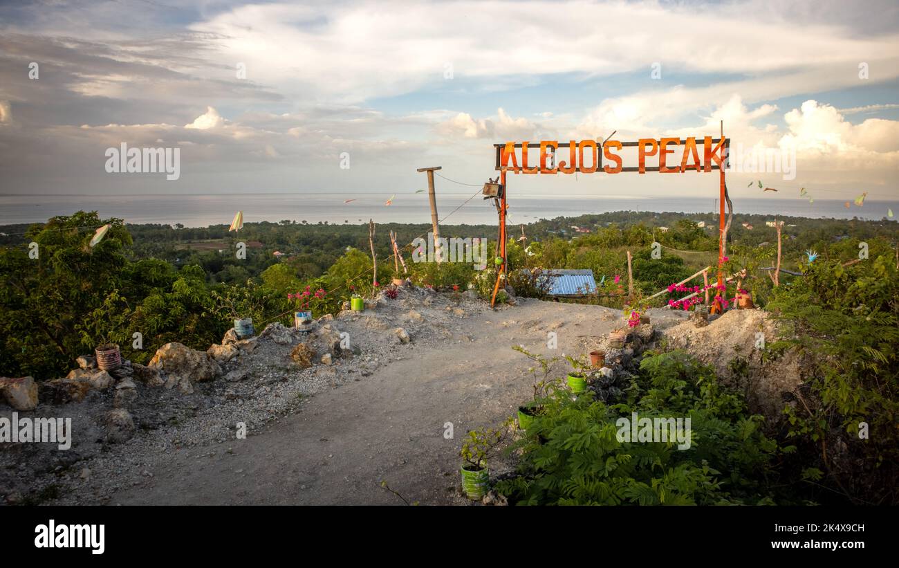A scenic view of Alejo's Peak park with a sign in Bogo, Cebu ...