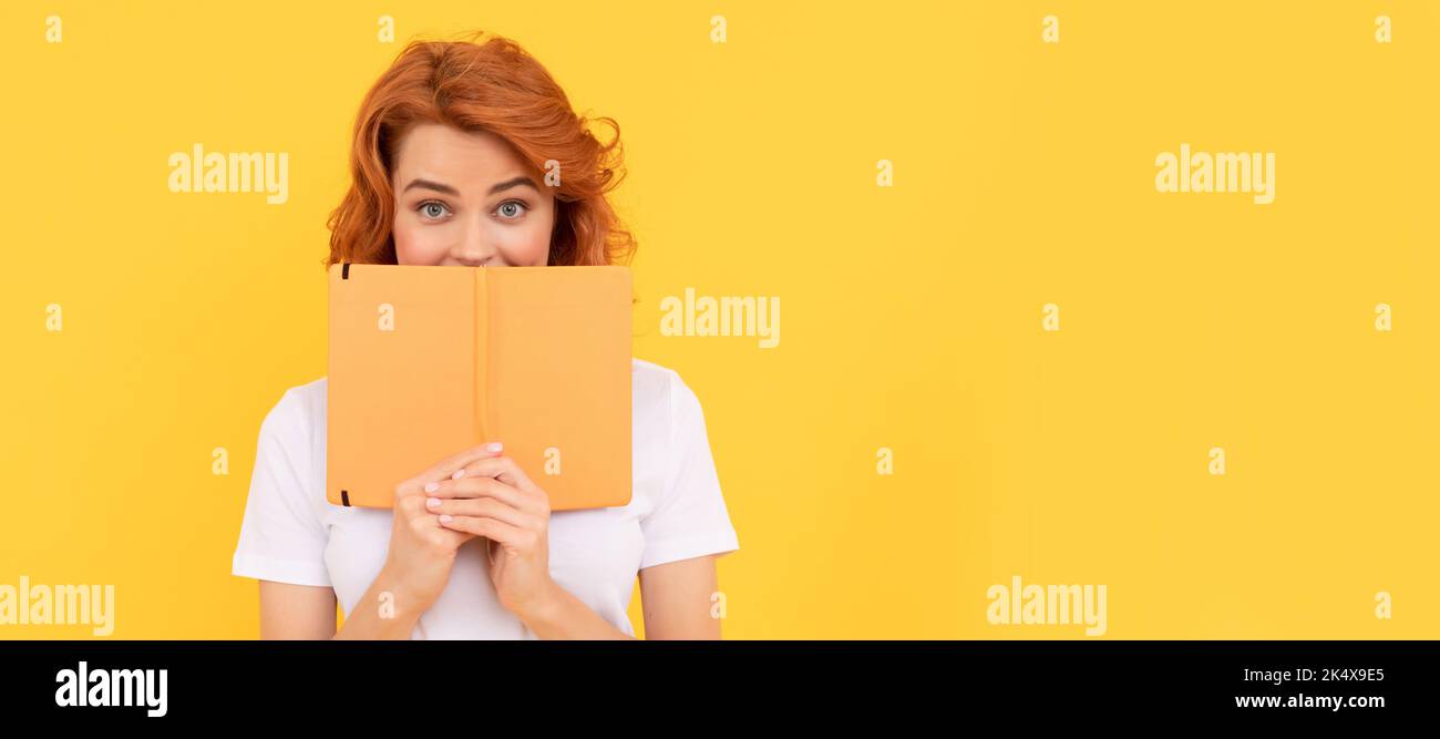 positive girl hold planner on yellow background, school. Woman isolated ...