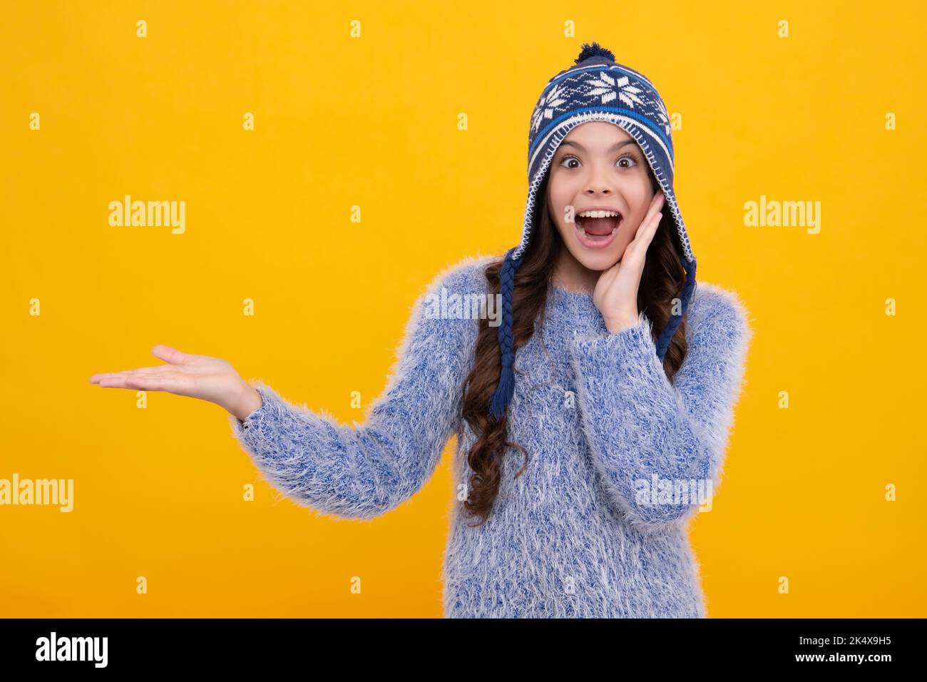Fashion happy young woman in knitted hat and sweater having fun over ...