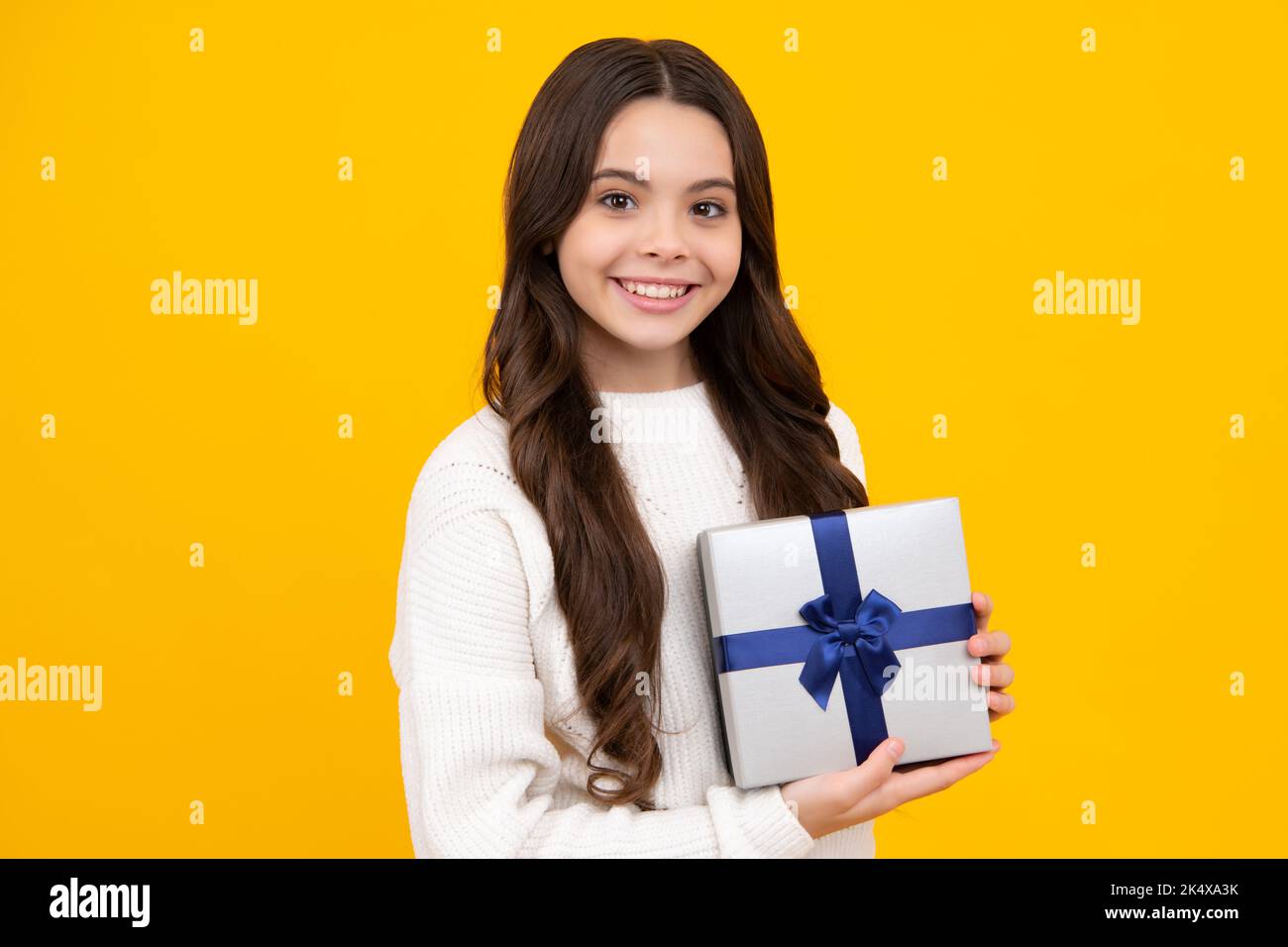Teenager kid with present box. Teen girl giving birthday gift. Present ...
