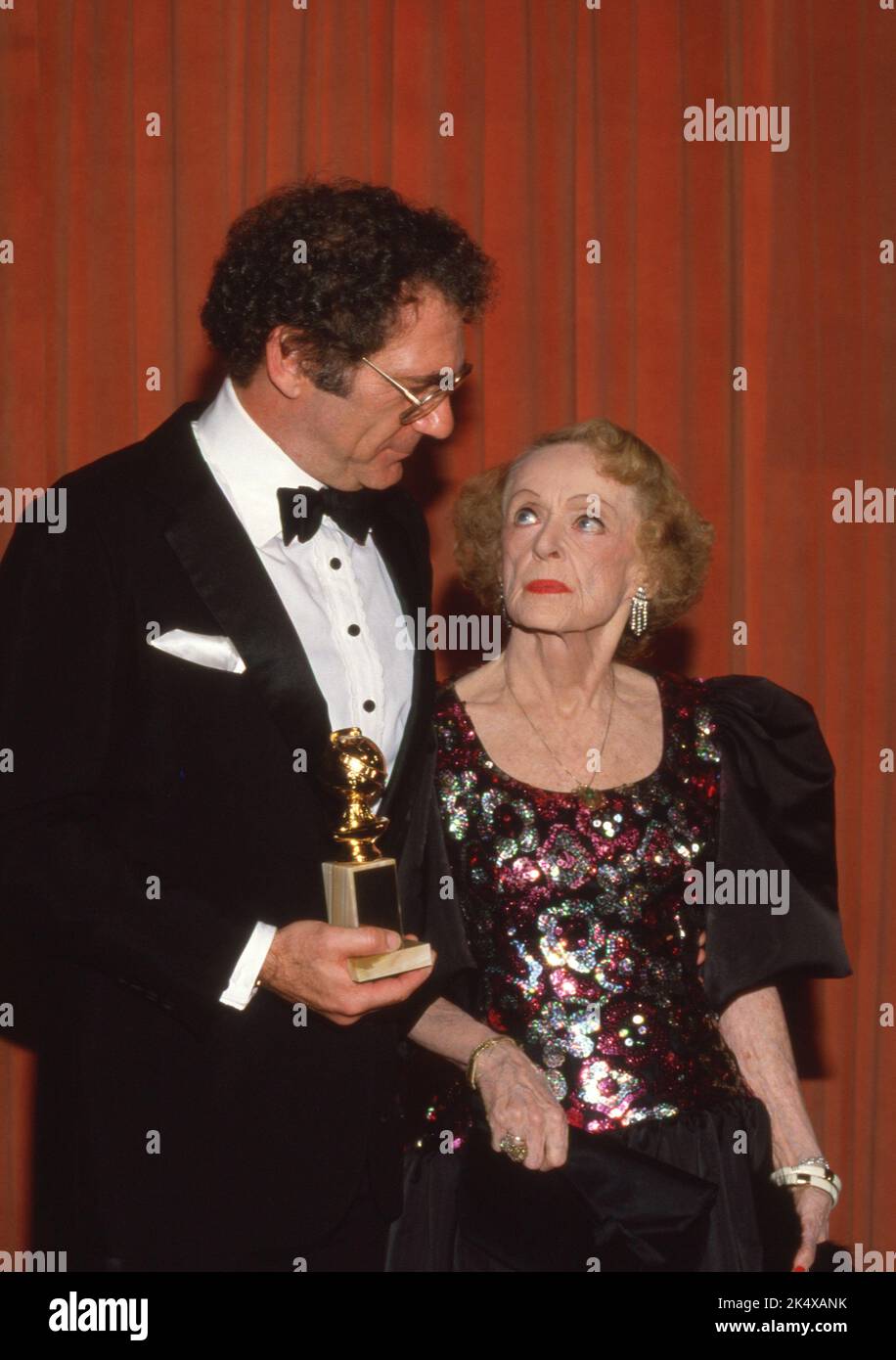 Bette Davis nd Sidney Pollack at the 43rd Annual Golden Globe Awards on ...
