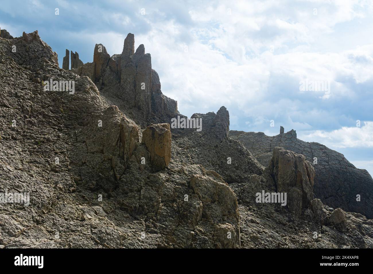 majestic rocks from volcanic columnar basalt against the sky, natural ...