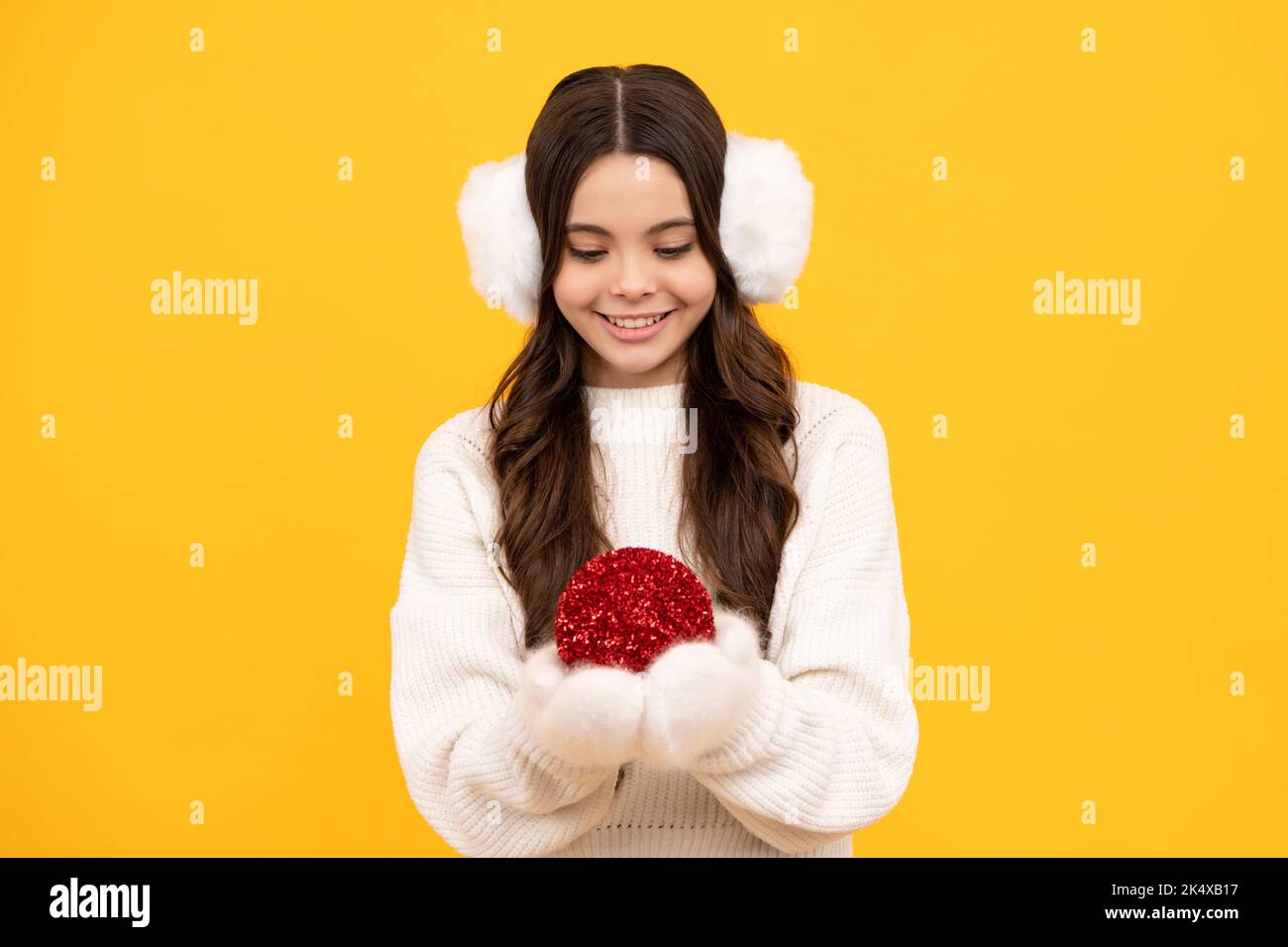 Portrait of teenager child girl wearing knitted gloves and winter ...