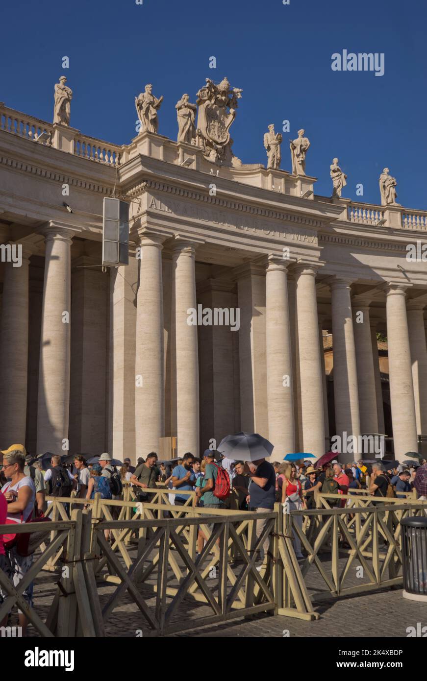 Visitors queue to enter Saint Peter's cathedral at the Vatican City ...