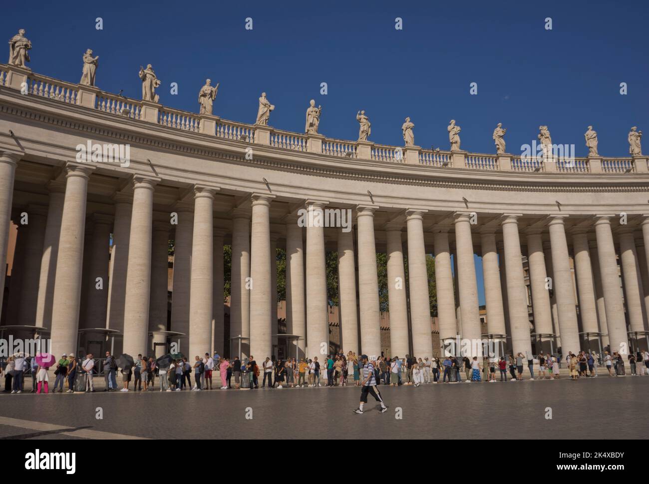 Visitors queue to enter Saint Peter's cathedral at the Vatican City ...